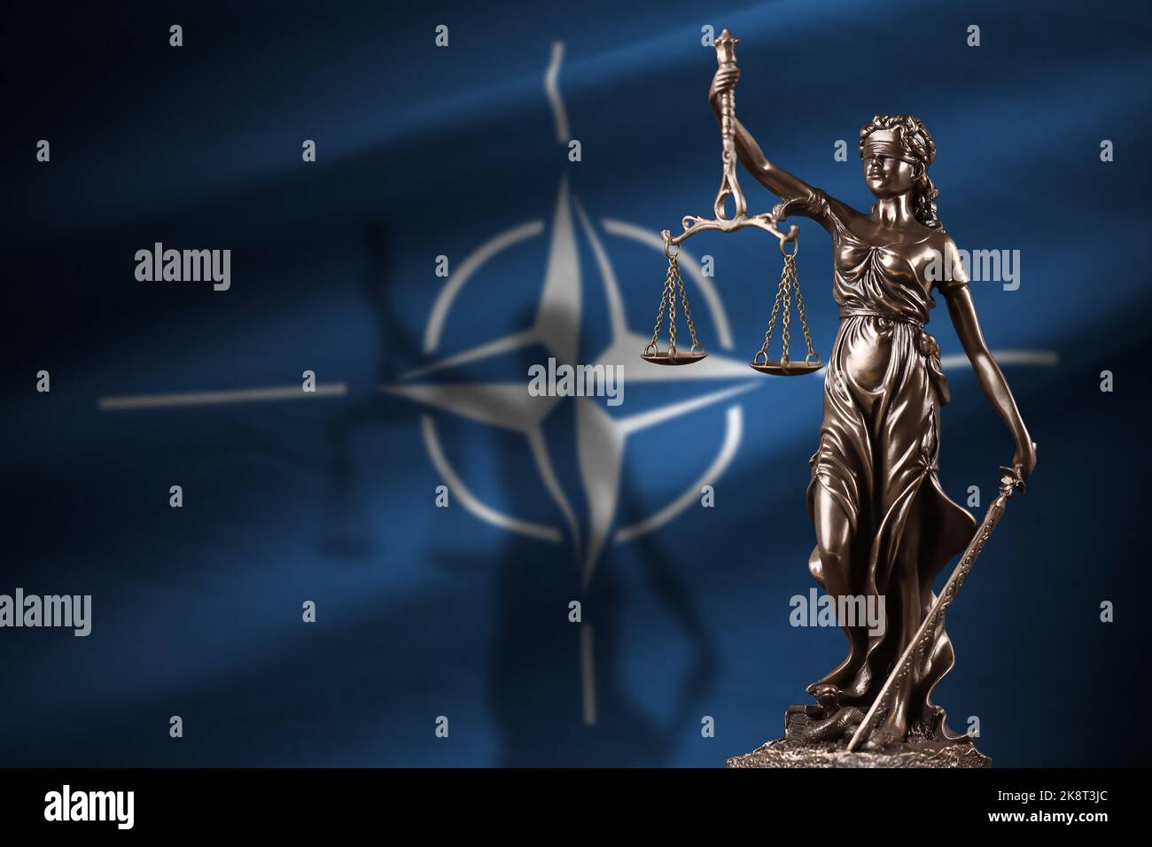 Abkhazia flag with statue of lady justice and judicial scales in dark room. Concept of judgement ...