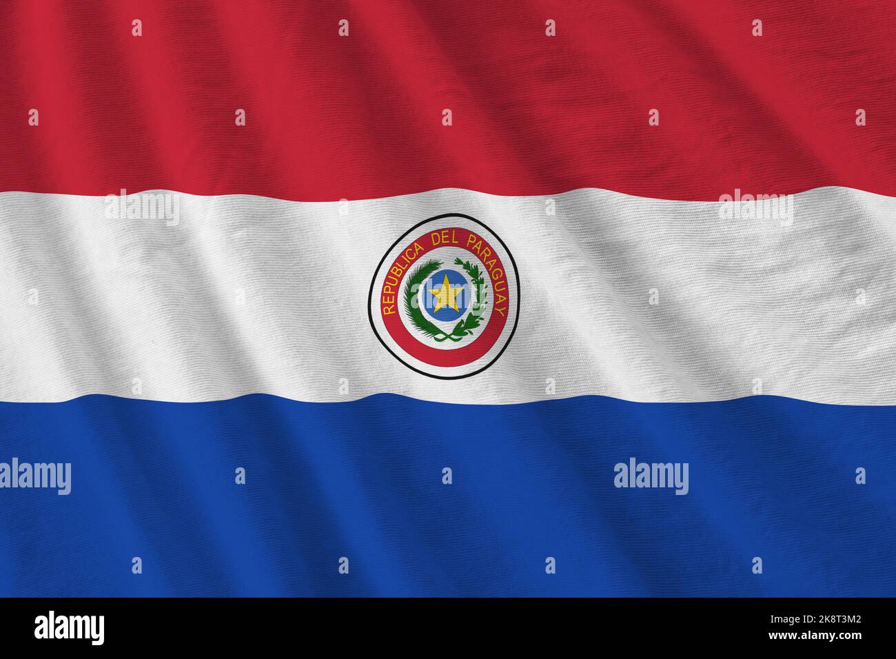 Paraguay flag with big folds waving close up under the studio light ...