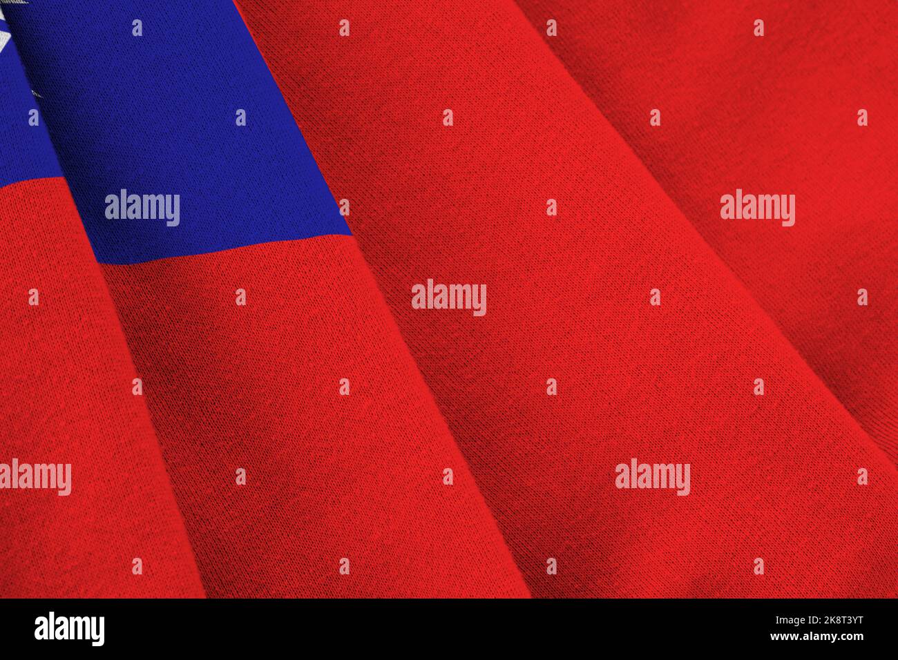 Taiwan flag with big folds waving close up under the studio light ...