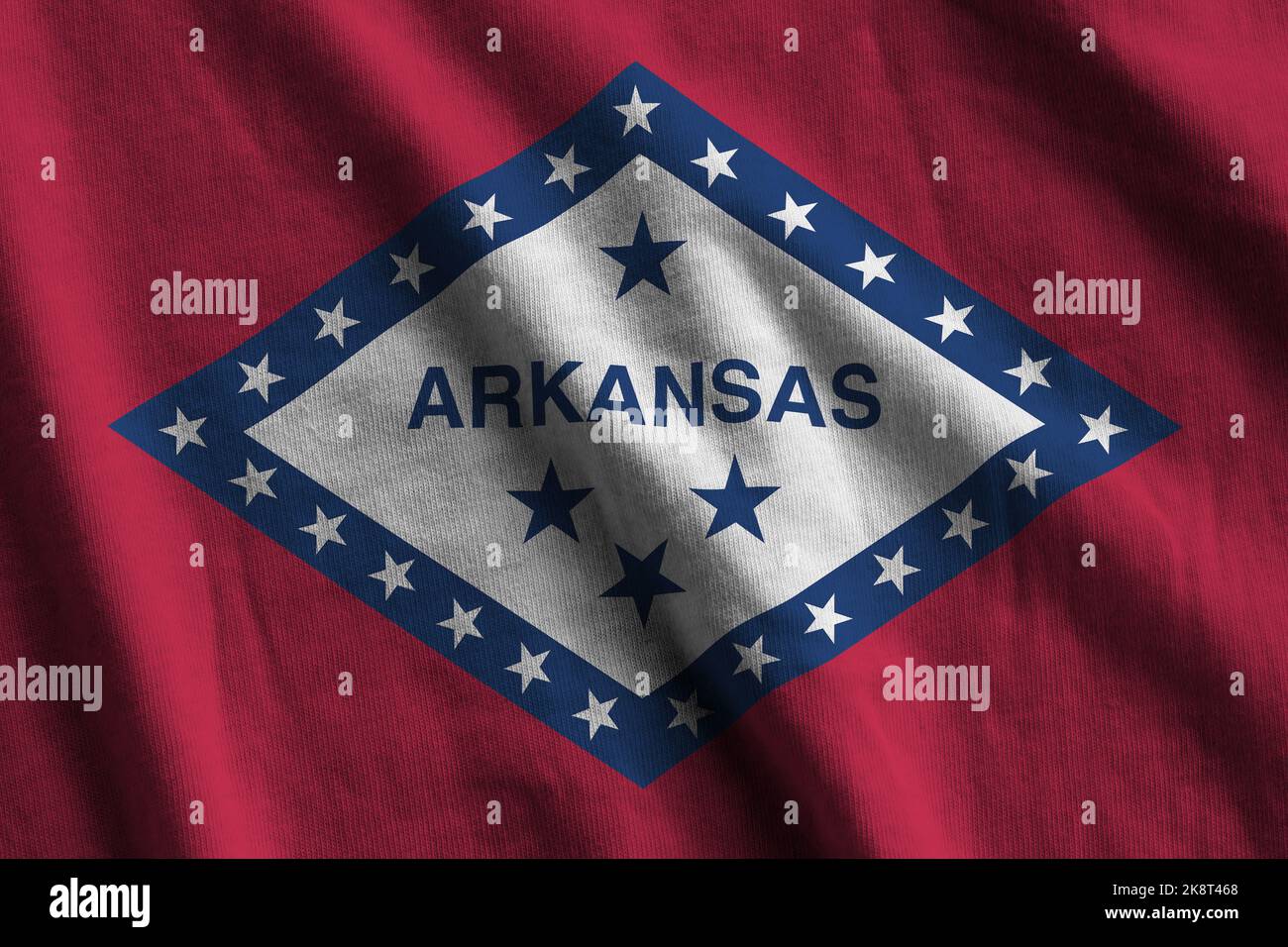 Arkansas US state flag with big folds waving close up under the studio ...