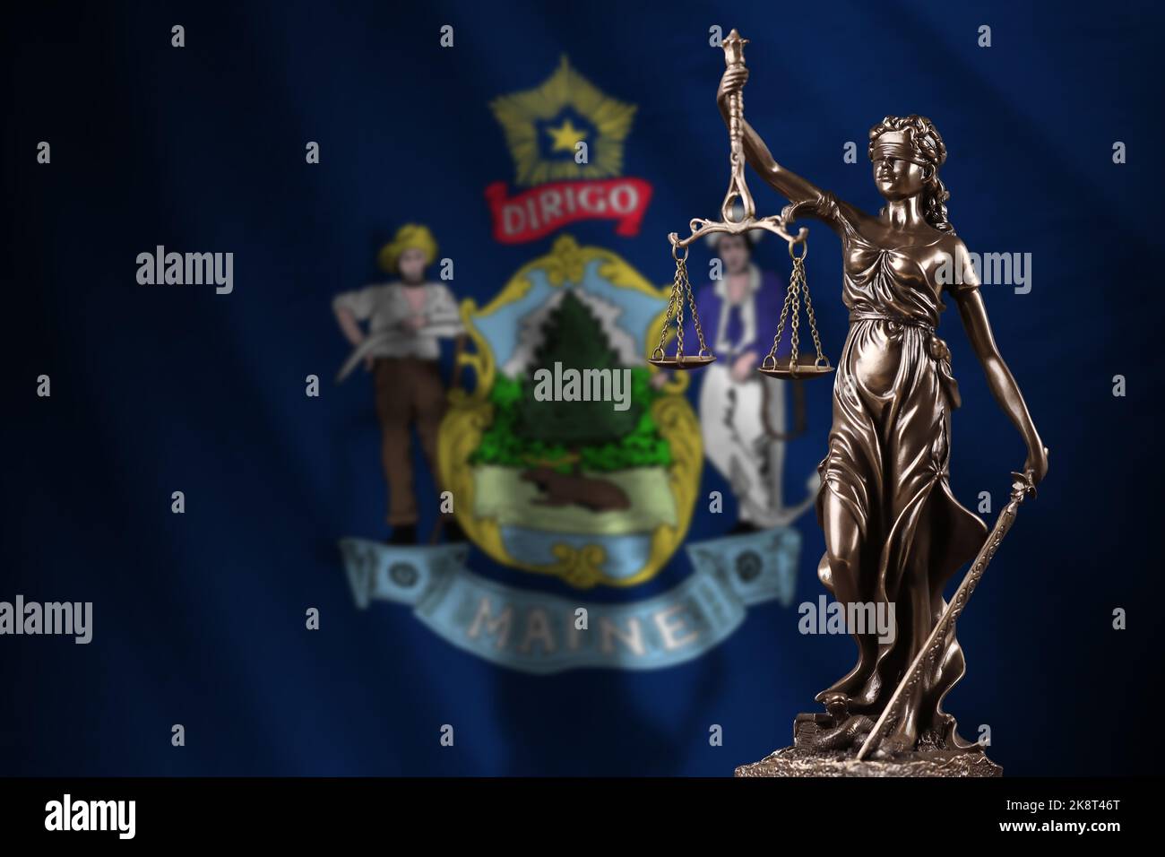 Maine US state flag with statue of lady justice and judicial scales in ...