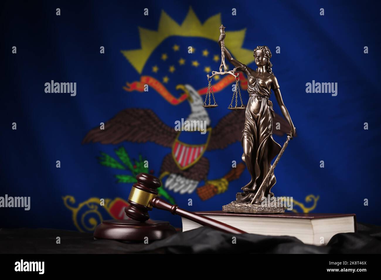 North Dakota US state flag with statue of lady justice, constitution ...