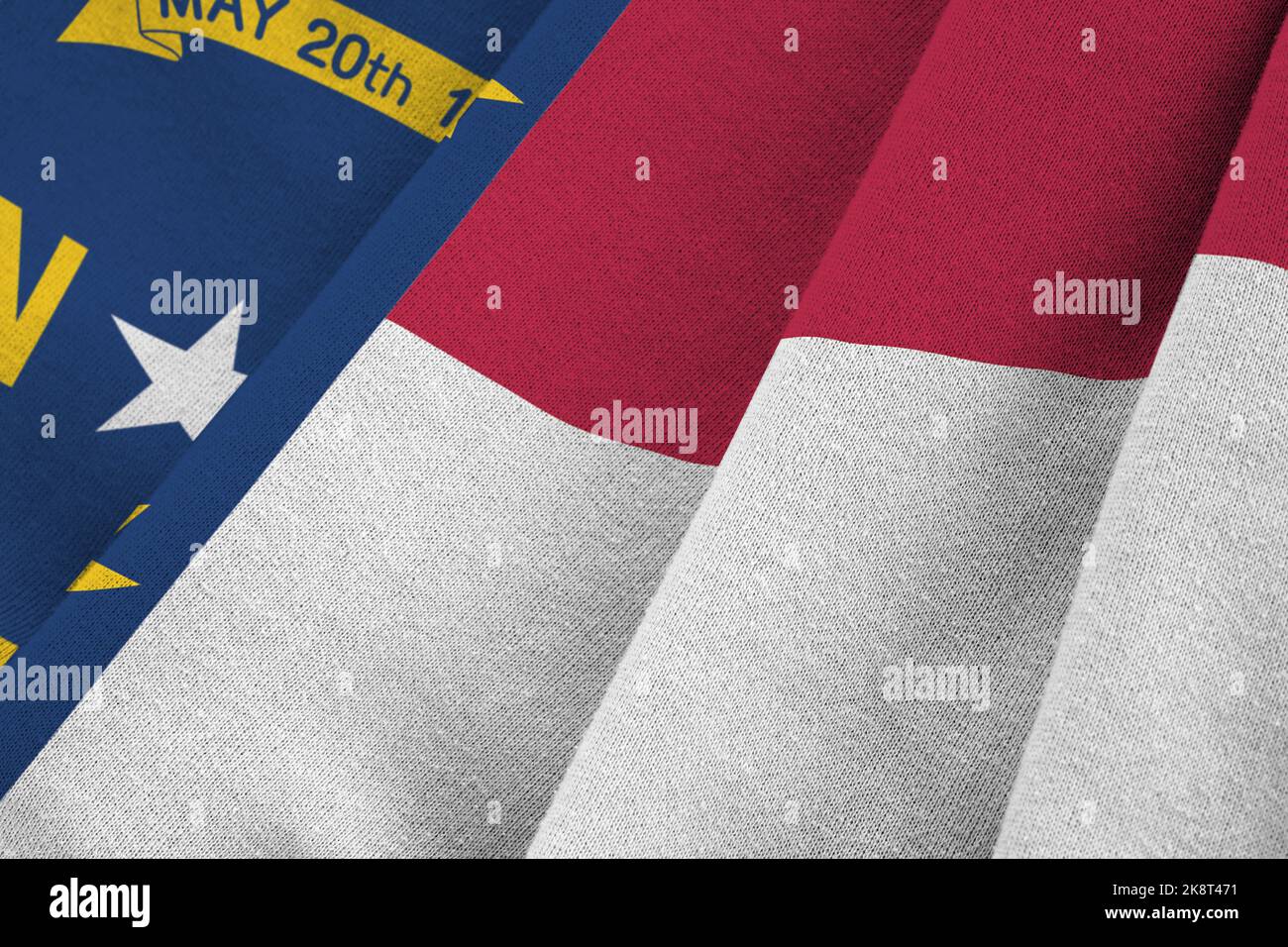 North Carolina US state flag with big folds waving close up under the ...