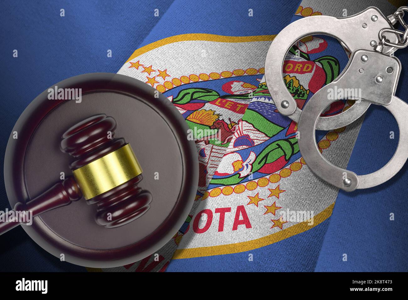 Minnesota US state flag with judge mallet and handcuffs in dark room ...