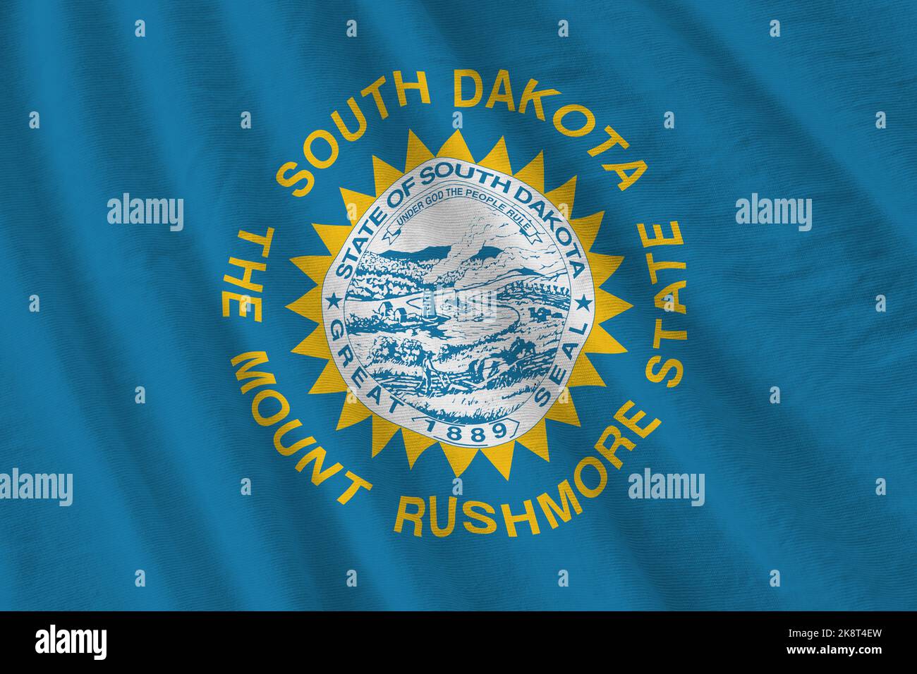 South Dakota US state flag with big folds waving close up under the ...