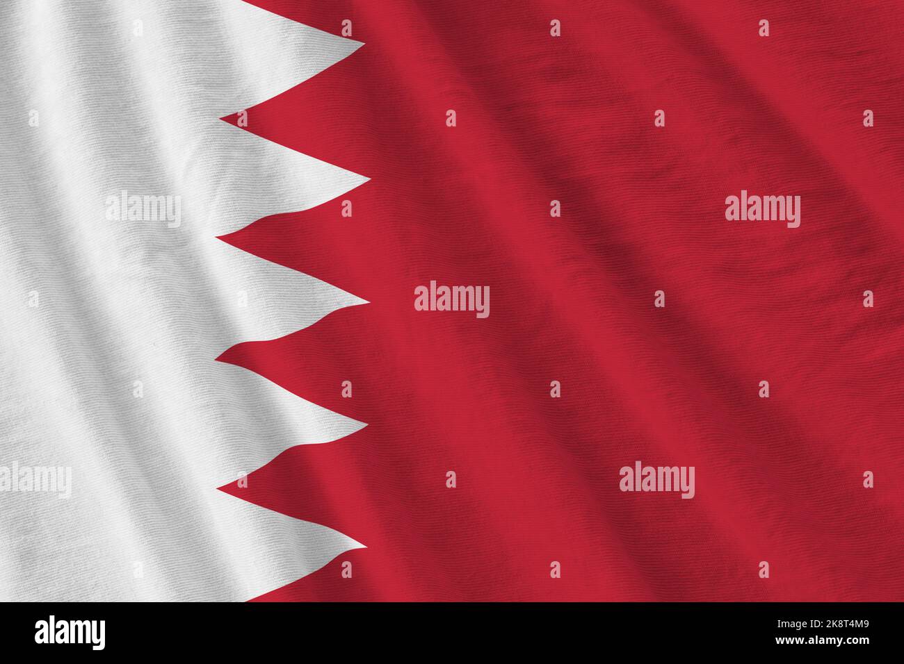 Bahrain flag with big folds waving close up under the studio light ...