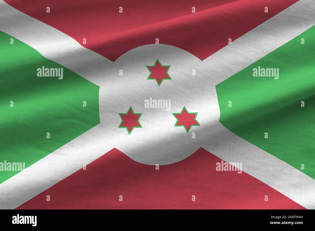 Burundi flag with big folds waving close up under the studio light ...