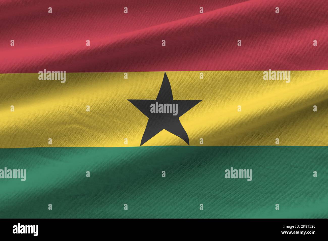 Ghana flag with big folds waving close up under the studio light ...