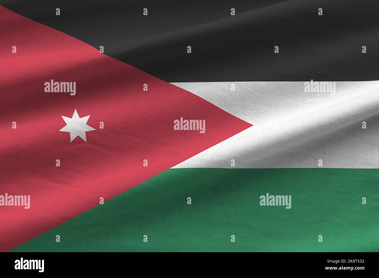 Jordan flag with big folds waving close up under the studio light ...