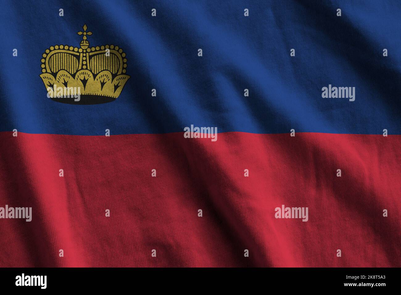 Liechtenstein flag with big folds waving close up under the studio ...