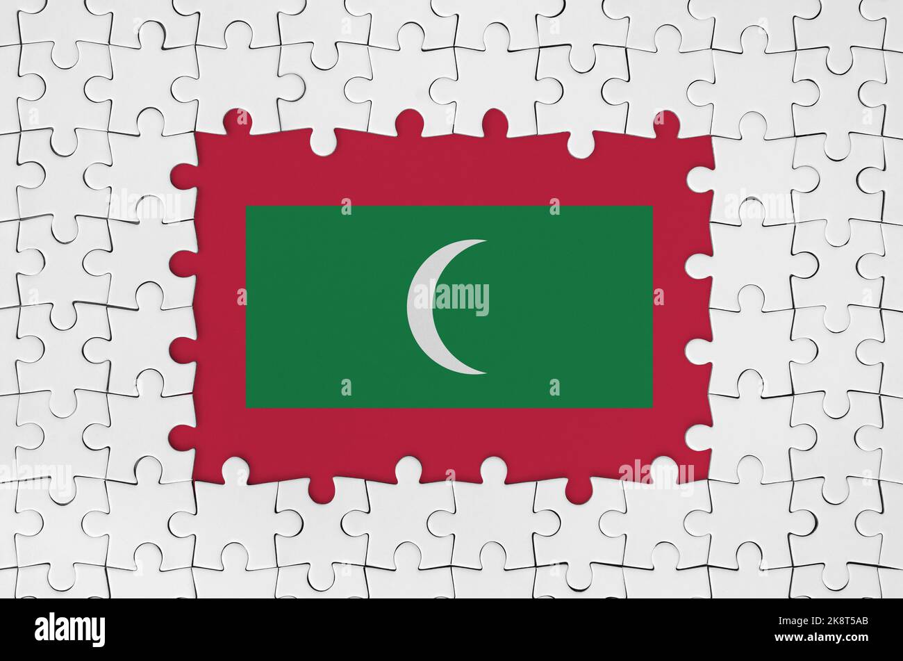 Maldives flag in frame of white puzzle pieces with missing central ...
