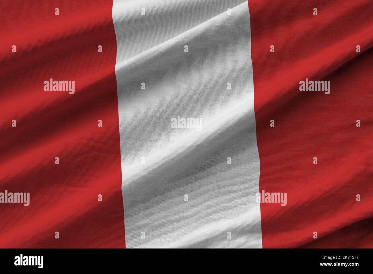 Peru flag with big folds waving close up under the studio light indoors ...