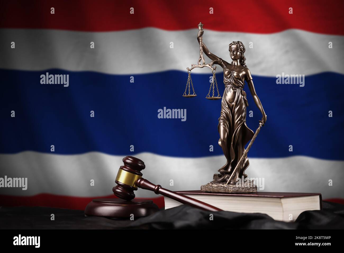 Thailand flag with statue of lady justice, constitution and judge ...