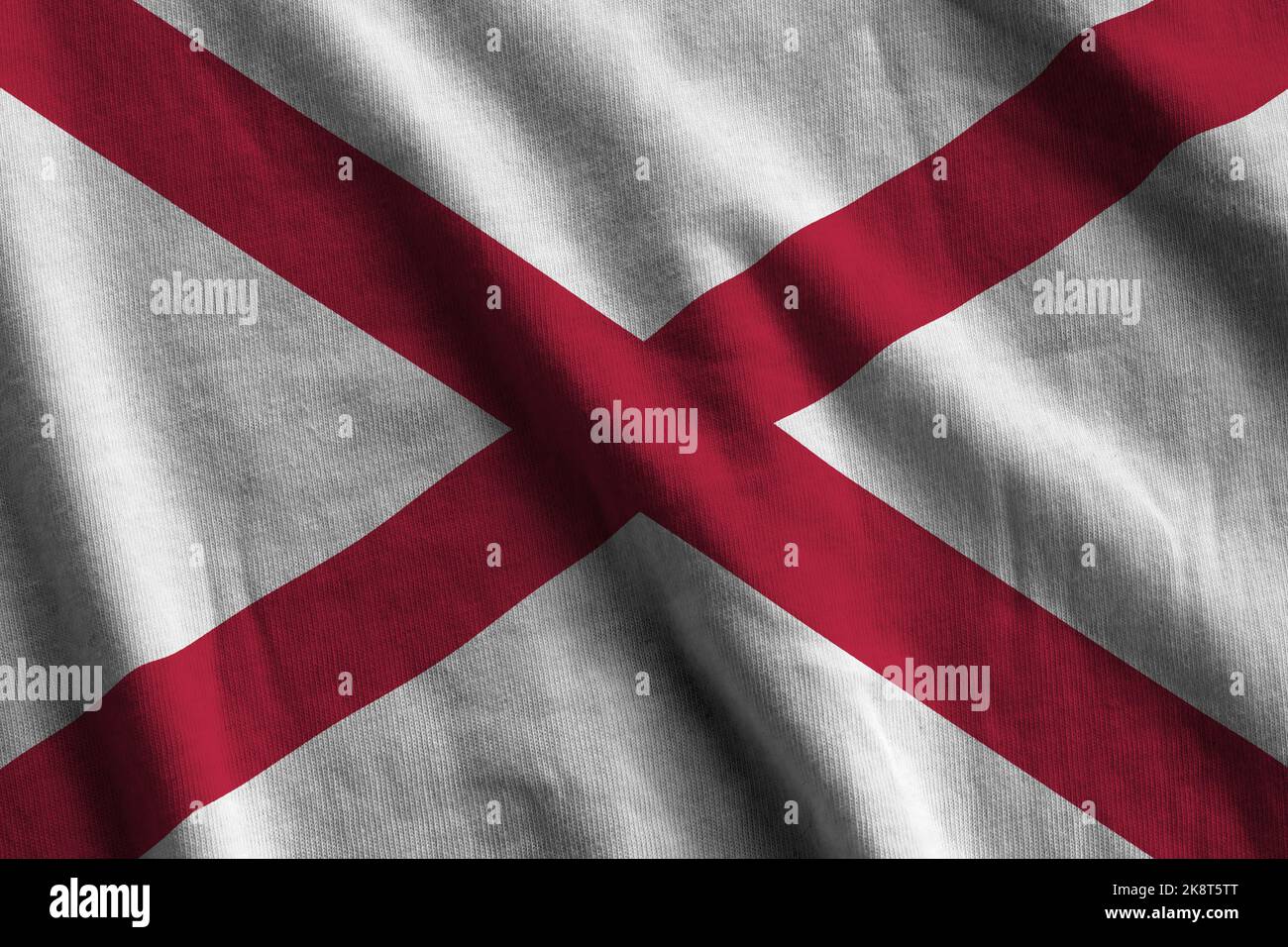 Alabama US state flag with big folds waving close up under the studio ...