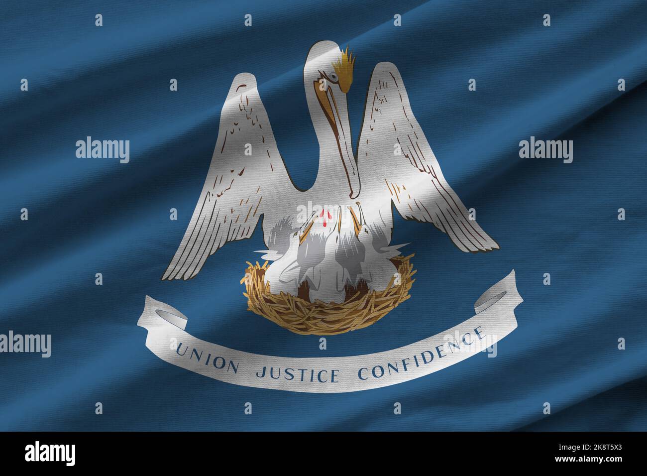 Louisiana US state flag with big folds waving close up under the studio ...