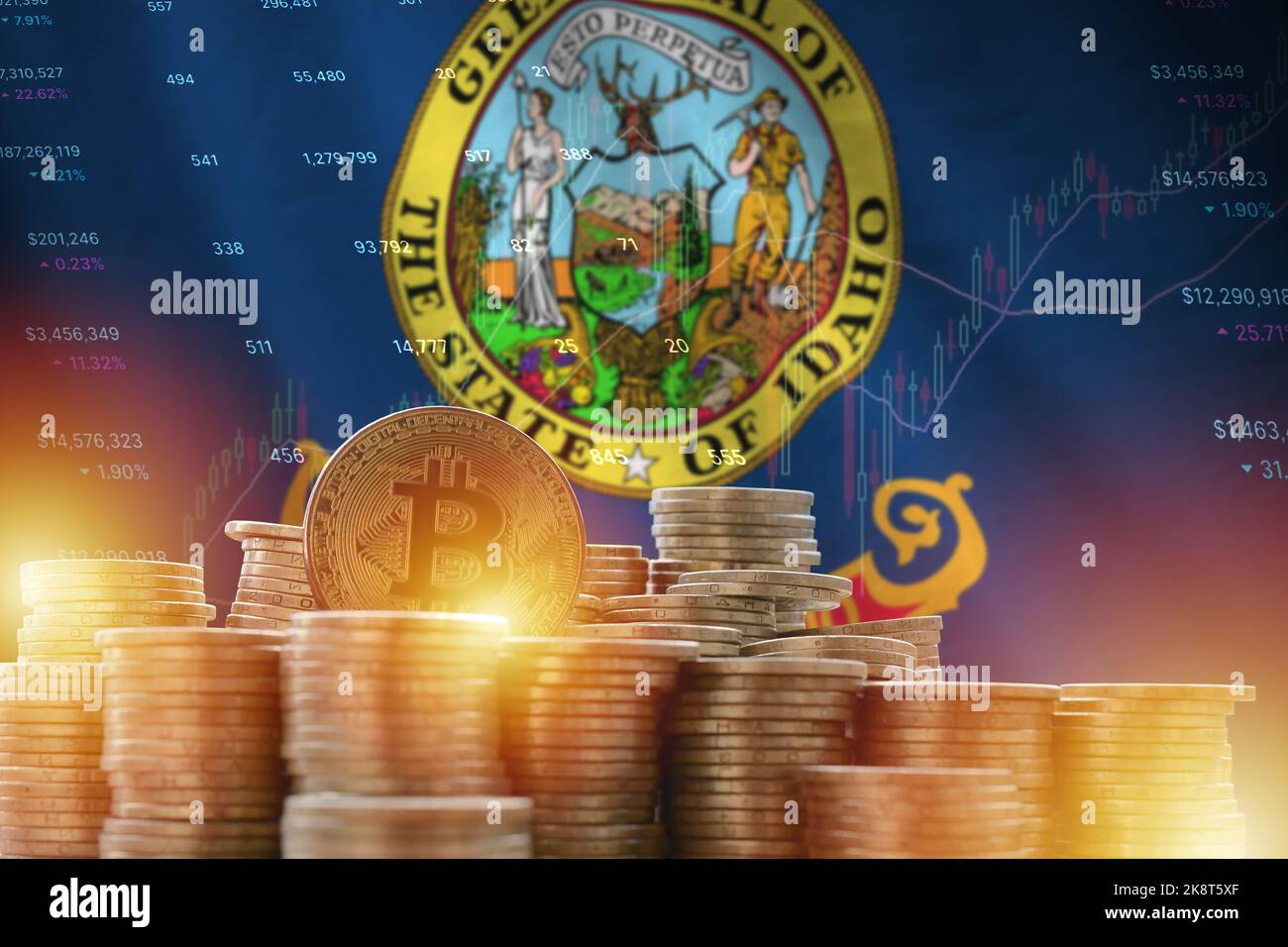Idaho US state flag and big amount of golden bitcoin coins and trading ...