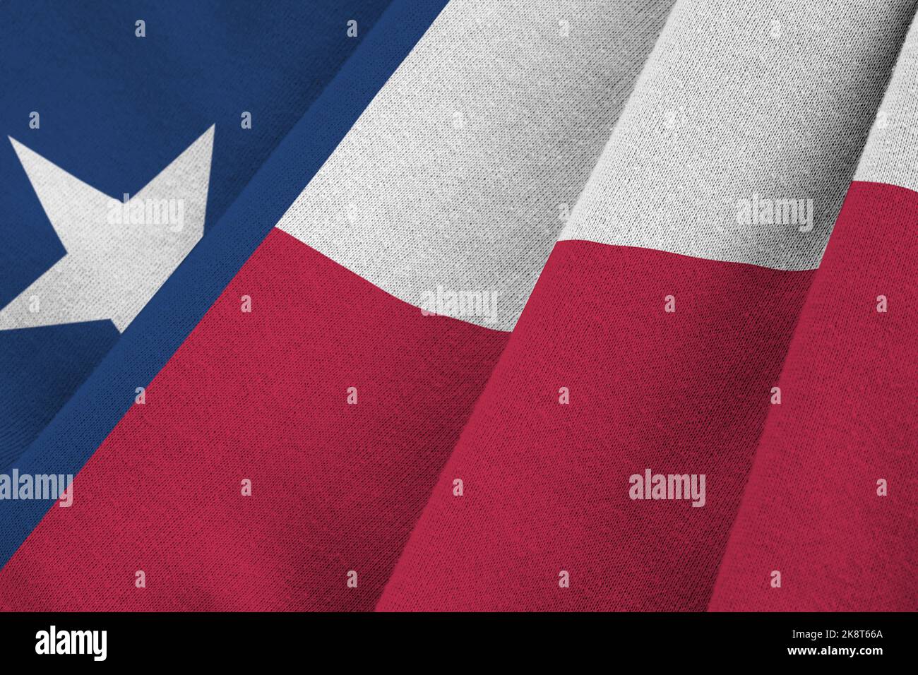Texas US state flag with big folds waving close up under the studio ...
