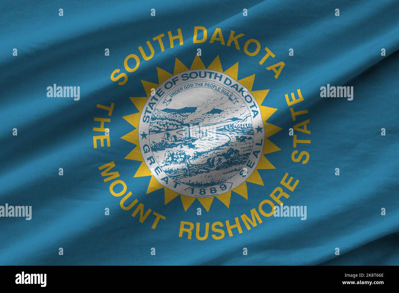 South Dakota US state flag with big folds waving close up under the ...