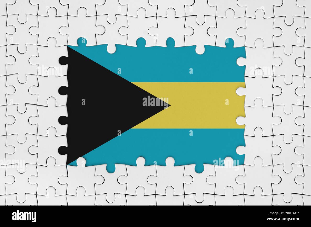 Bahamas flag in frame of white puzzle pieces with missing central parts ...
