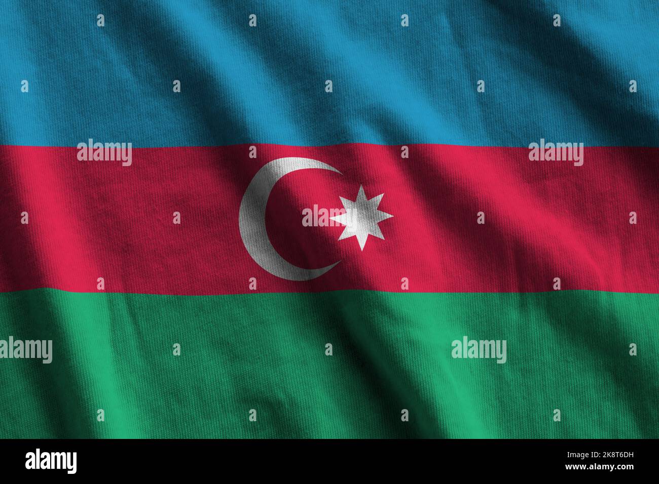 Azerbaijan flag with big folds waving close up under the studio light ...