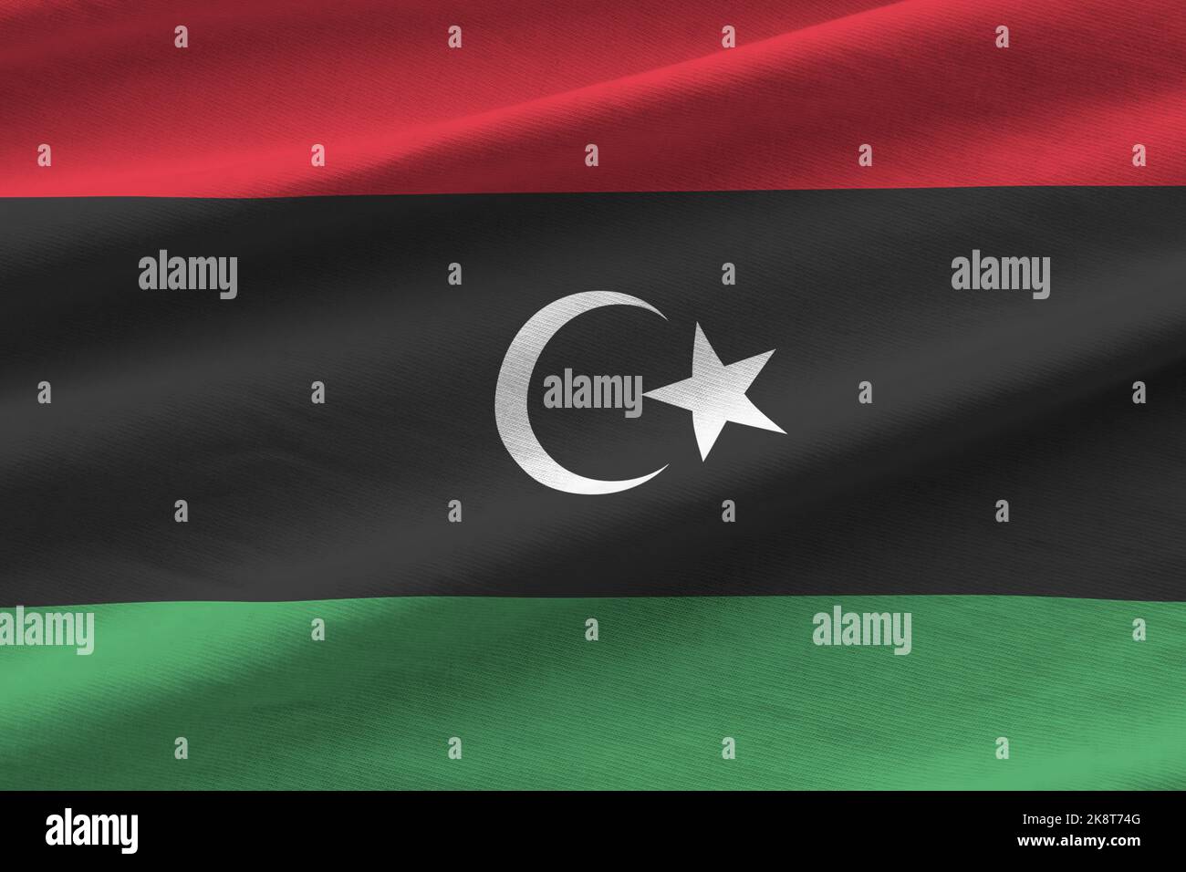 Libya flag with big folds waving close up under the studio light ...