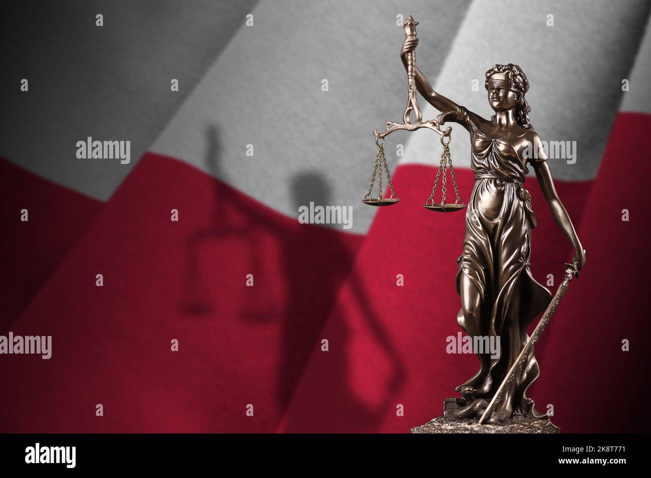 Poland flag with statue of lady justice and judicial scales in dark ...