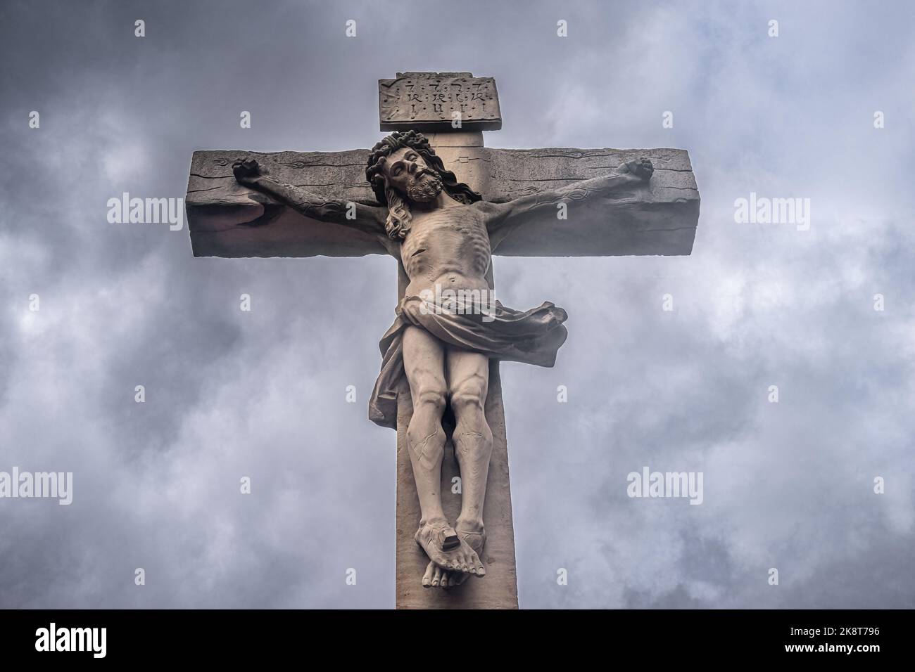 A low-angle shot of the Sculpture of the Crucifixion of Christ against ...
