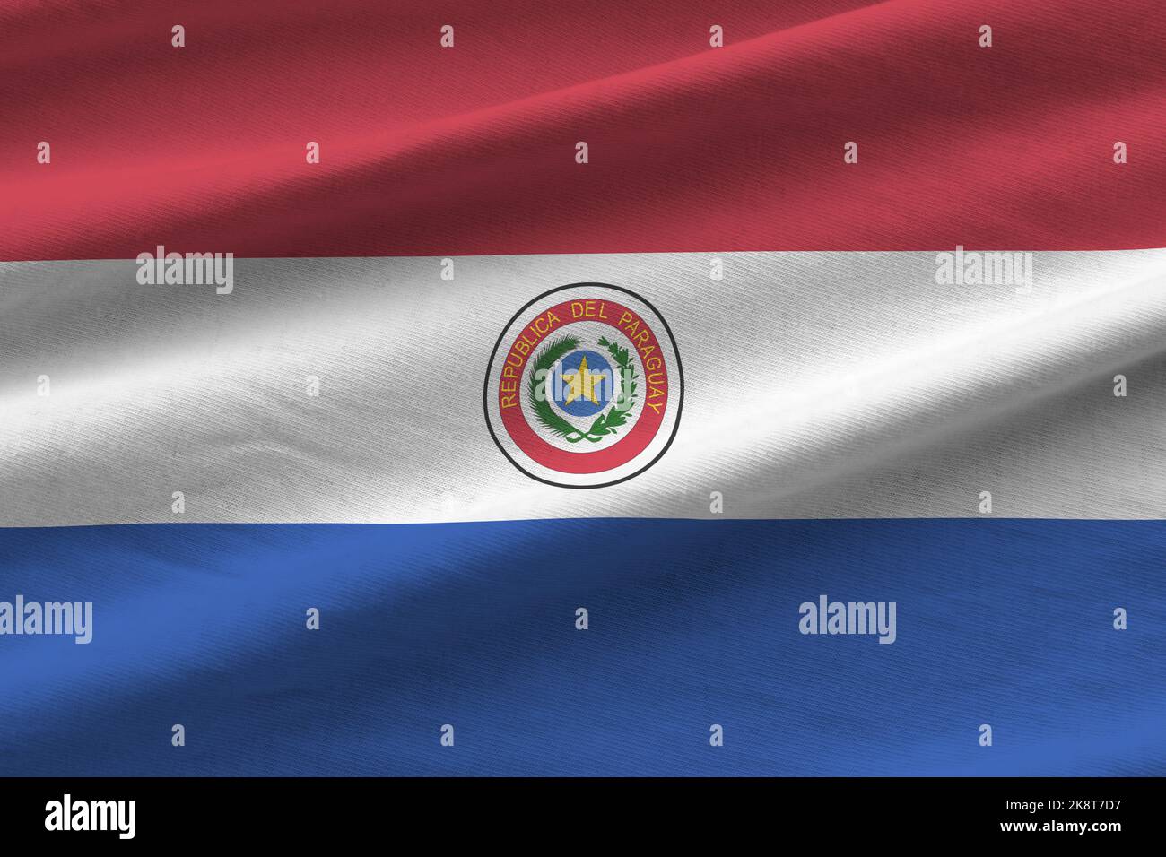 Paraguay flag with big folds waving close up under the studio light ...