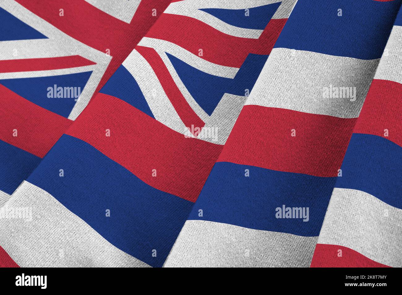 Hawaii US state flag with big folds waving close up under the studio ...