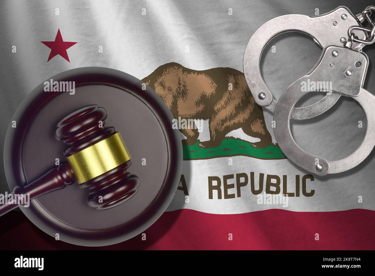 California US state flag with judge mallet and handcuffs in dark room ...