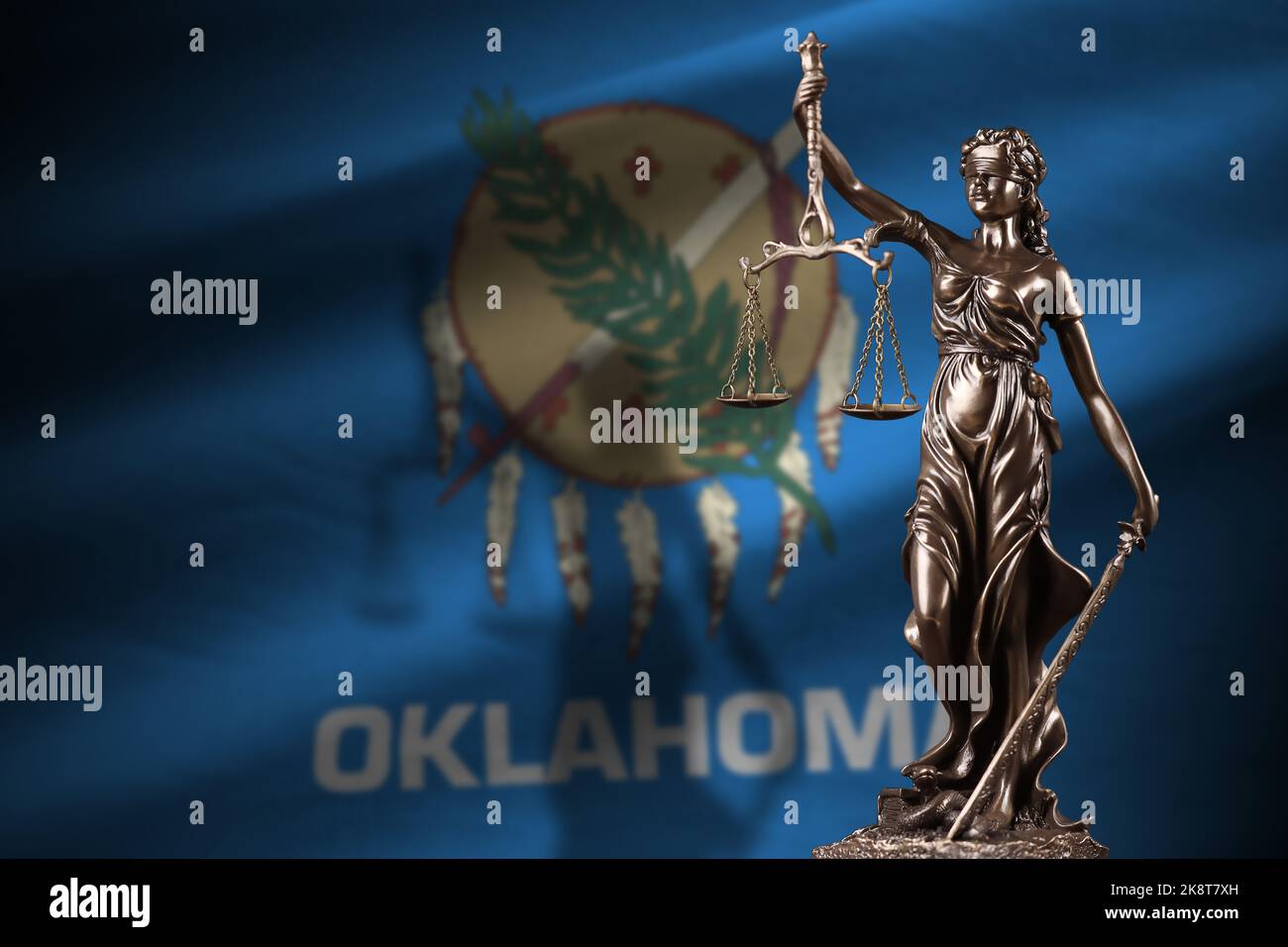Oklahoma US state flag with statue of lady justice and judicial scales ...