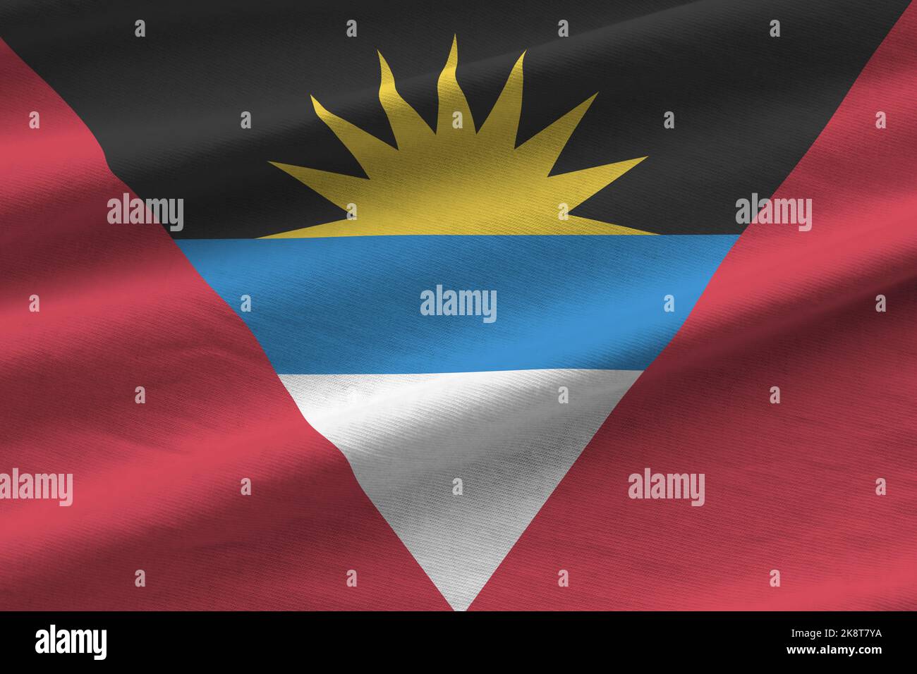 Antigua and Barbuda flag with big folds waving close up under the ...