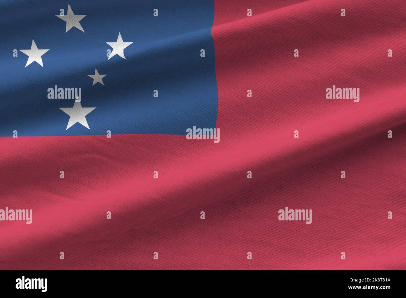 Samoa flag with big folds waving close up under the studio light ...