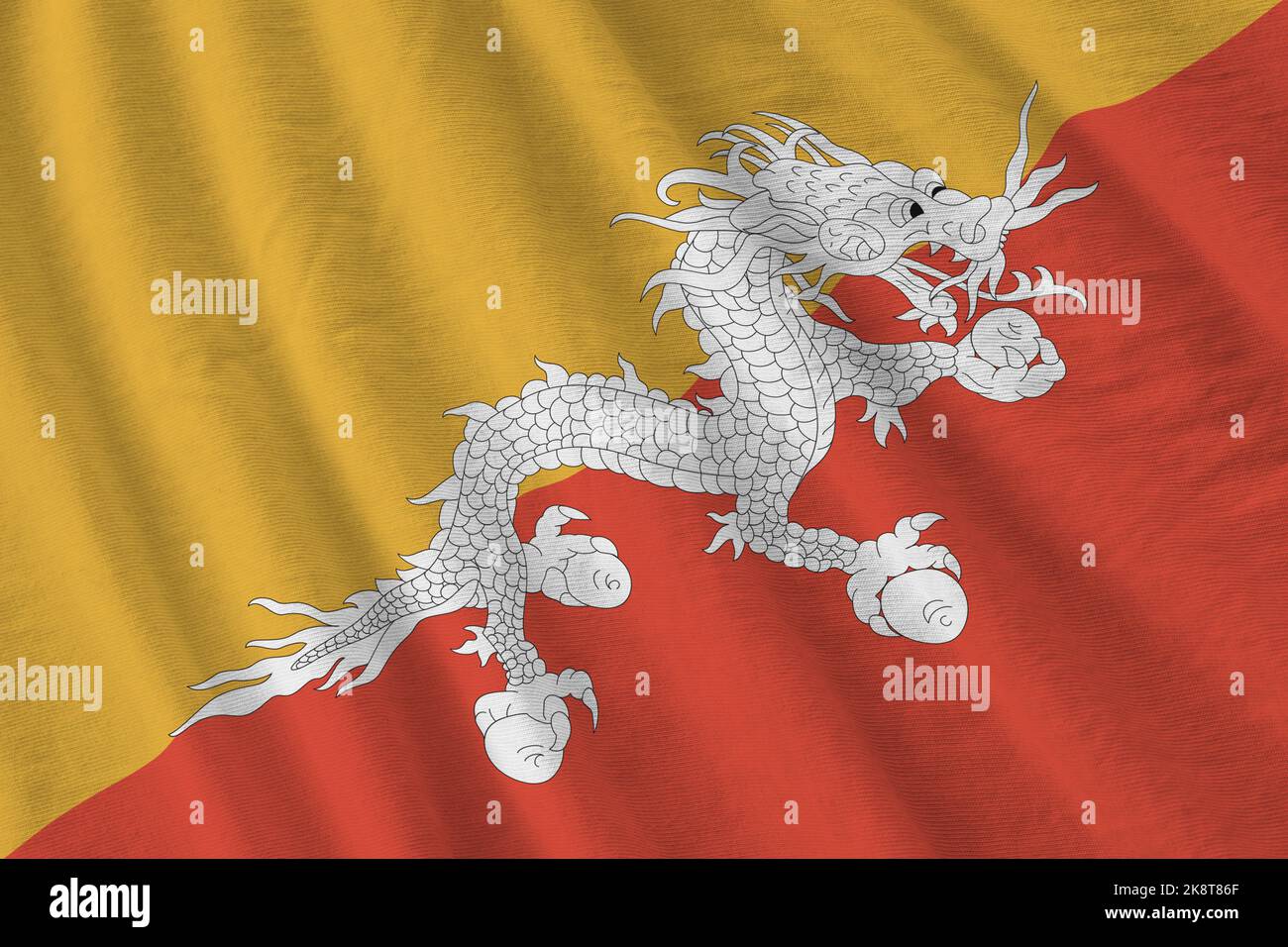 Bhutan flag with big folds waving close up under the studio light ...