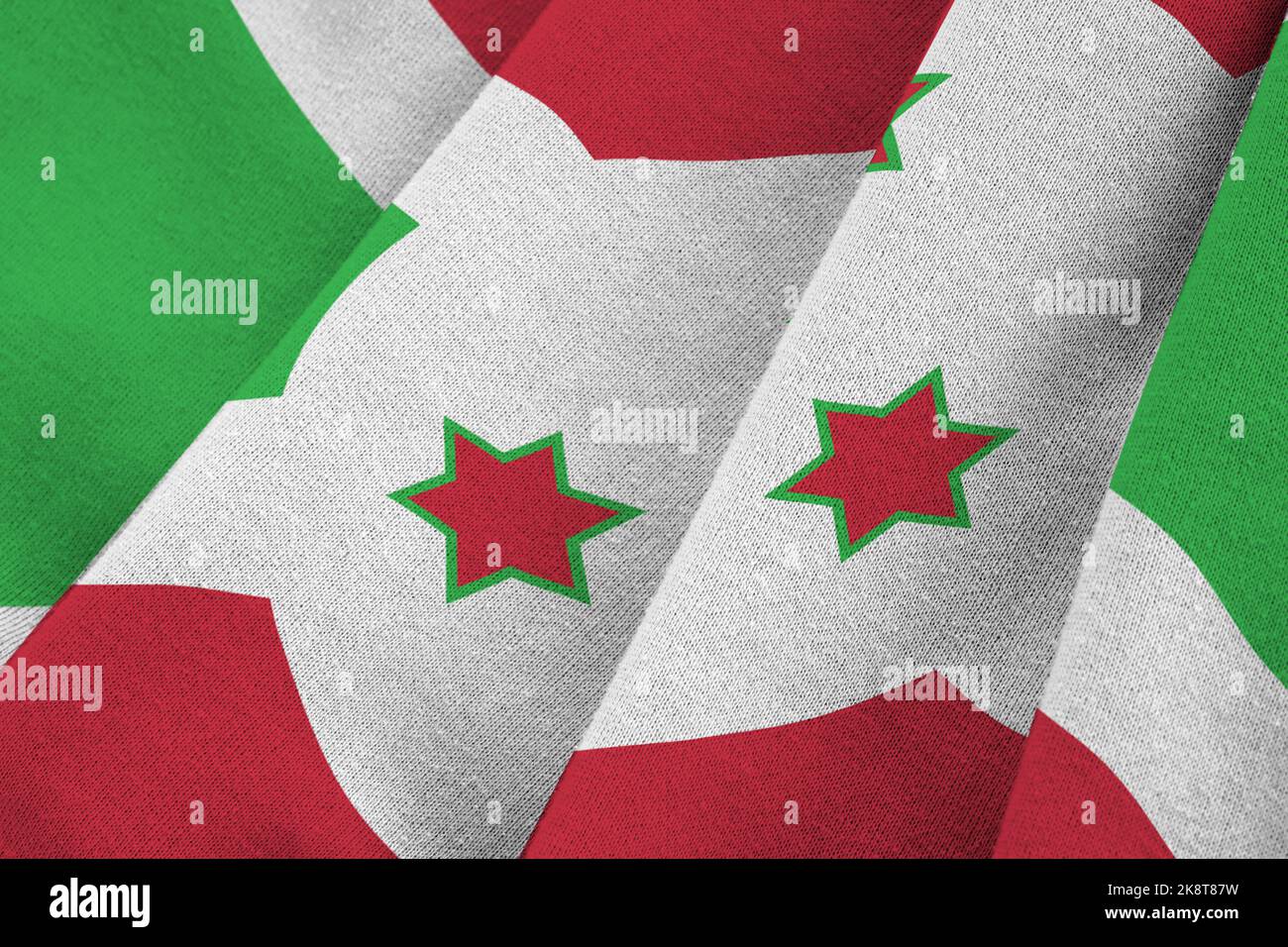 Burundi flag with big folds waving close up under the studio light ...