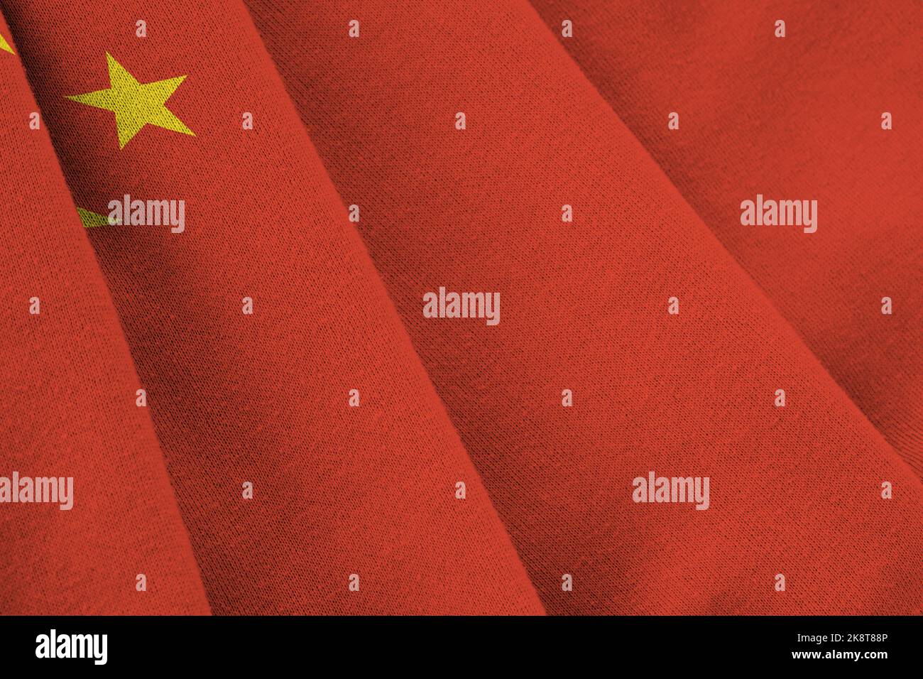 China flag with big folds waving close up under the studio light ...