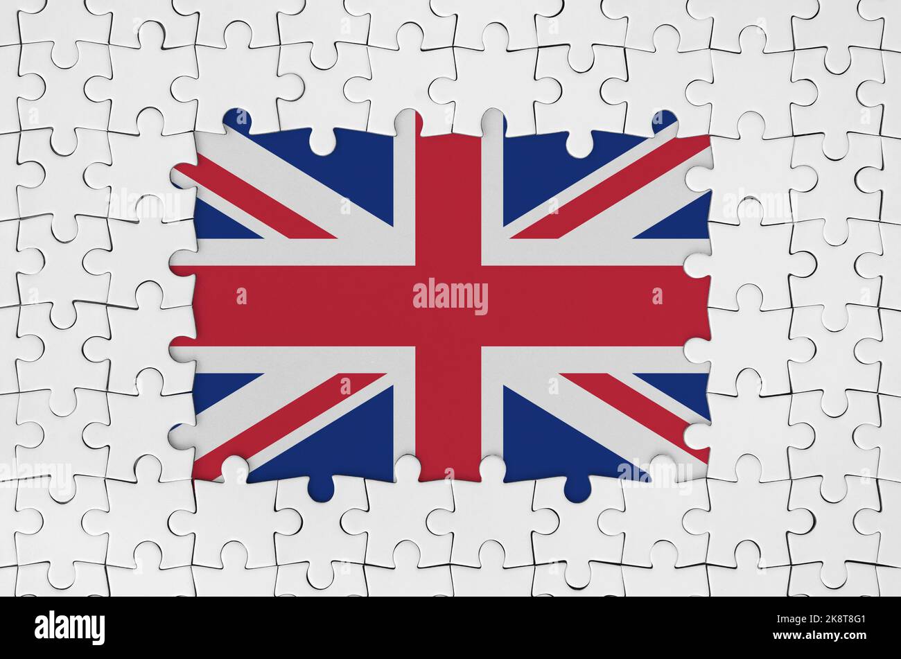 Great britain flag in frame of white puzzle pieces with missing central ...