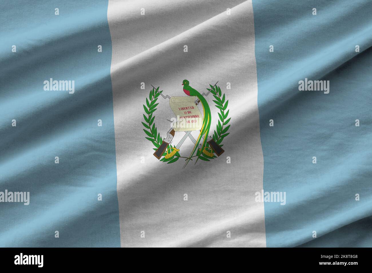 Guatemala flag with big folds waving close up under the studio light ...