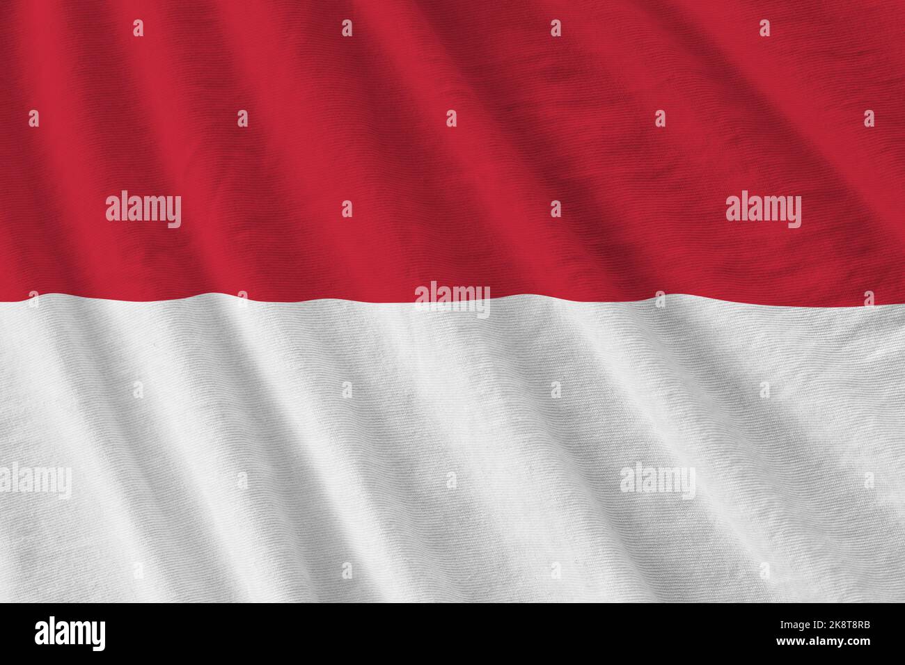 Indonesia flag with big folds waving close up under the studio light ...