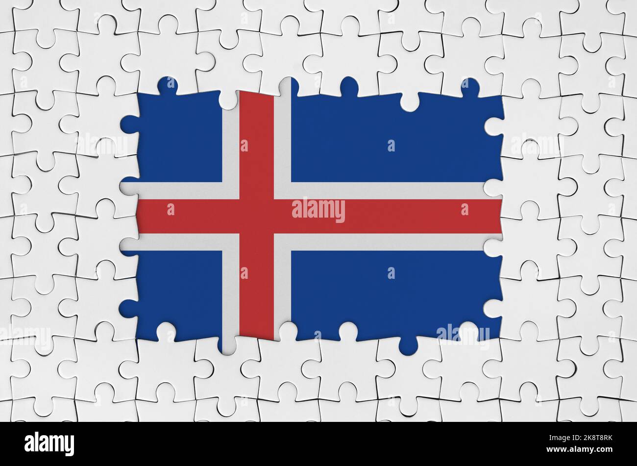 Iceland flag in frame of white puzzle pieces with missing central parts ...