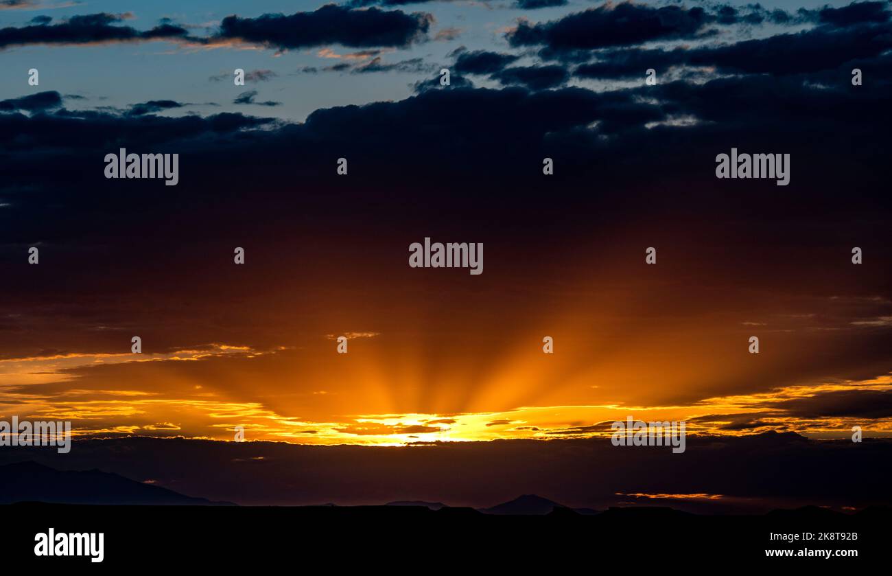 Beautiful sunset cloudscape with bright orange and yellow clouds in ...