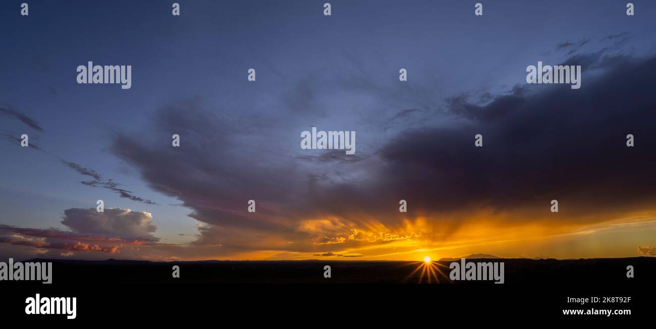 Beautiful sunset cloudscape with bright orange and yellow clouds in ...