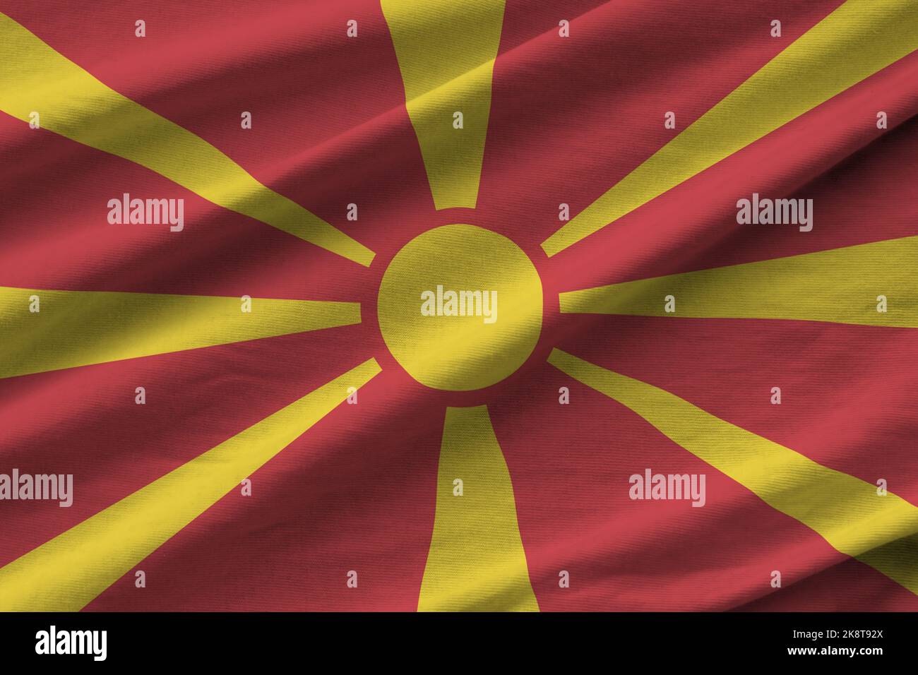 Macedonia flag with big folds waving close up under the studio light ...