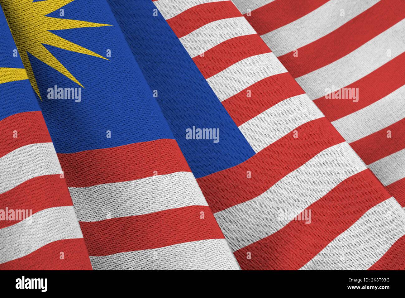 Malaysia flag with big folds waving close up under the studio light ...