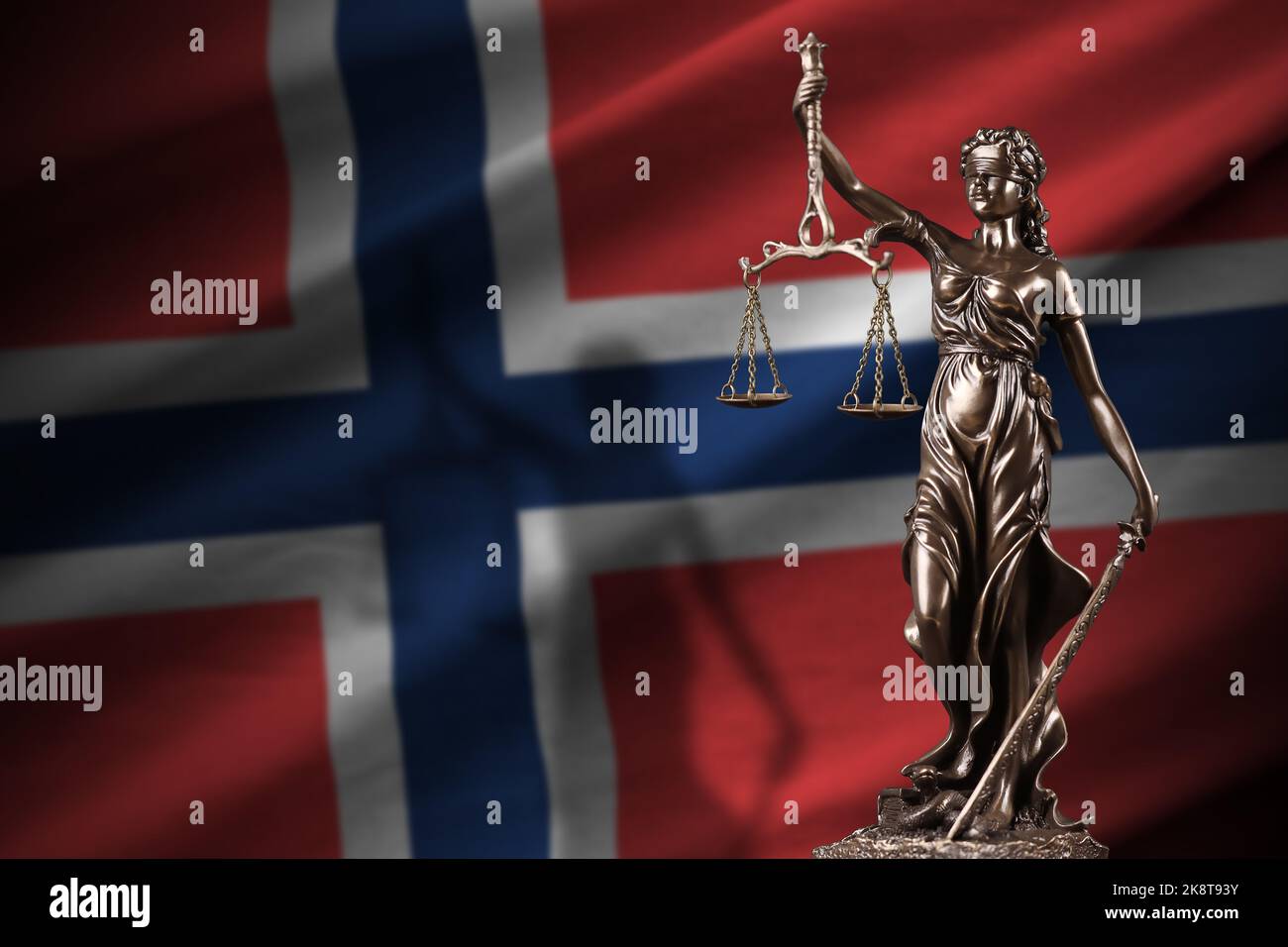 Norway flag with statue of lady justice and judicial scales in dark ...