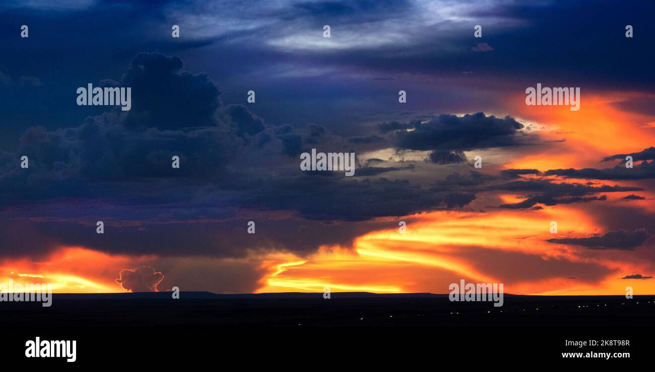 Beautiful sunset cloudscape with bright orange and yellow clouds in ...