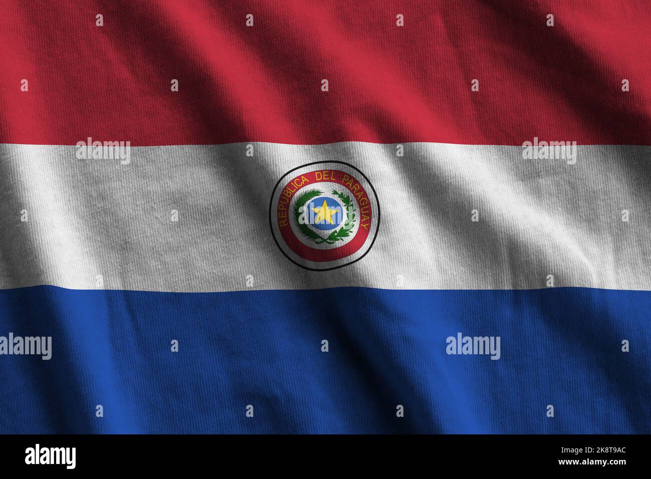 Paraguay flag with big folds waving close up under the studio light ...