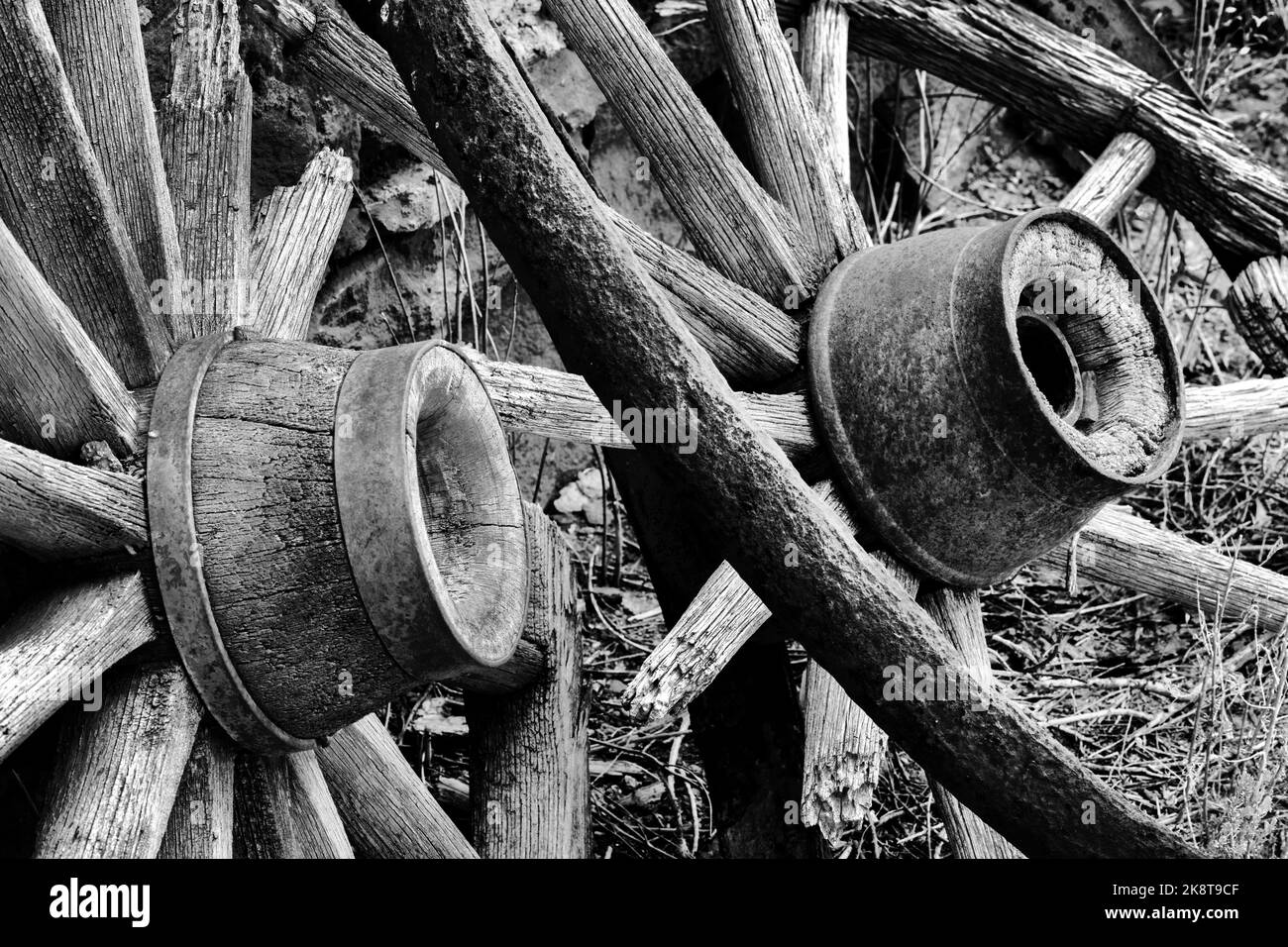 A grayscale closeup of weathered vintage wooden wagon wheels Stock ...
