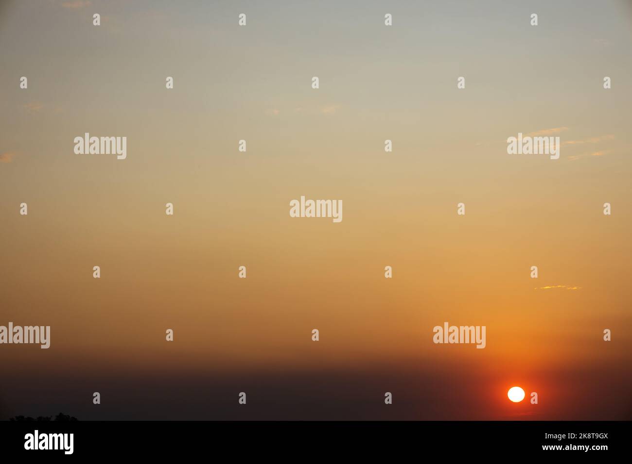 Solar sphere during sunset. The round sun disk dominates the landscape ...