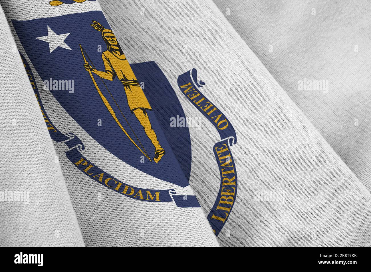 Massachusetts US state flag with big folds waving close up under the ...